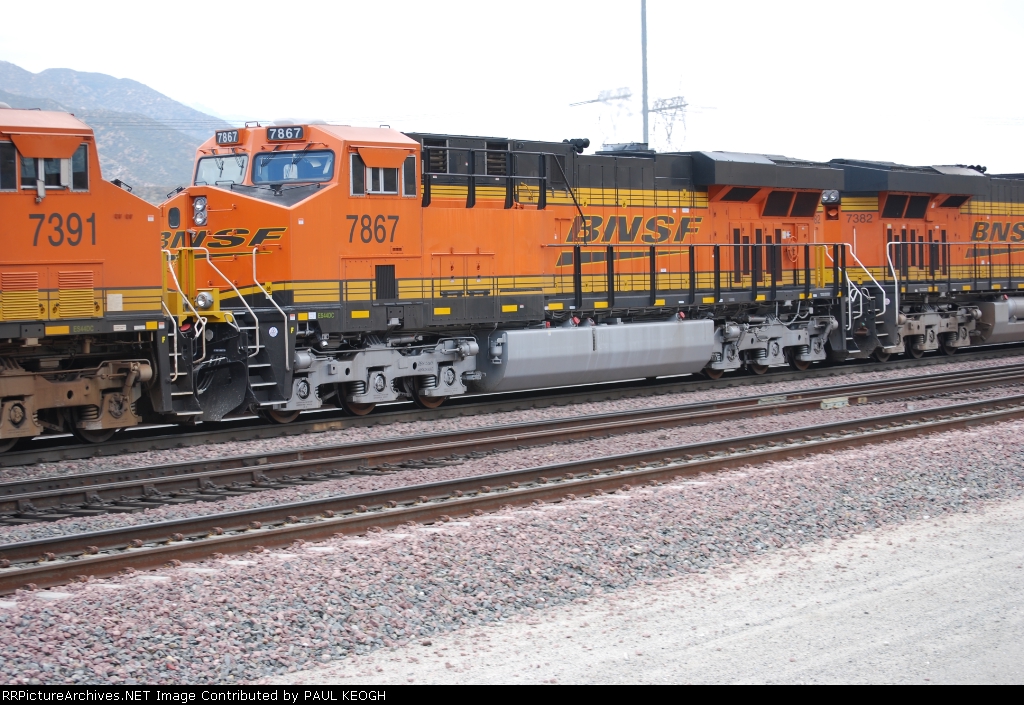 BNSF 7867 with two 7300 Series BNSF 7382 and BNSF 7391 pass me by as they roll east on Main 1 ...